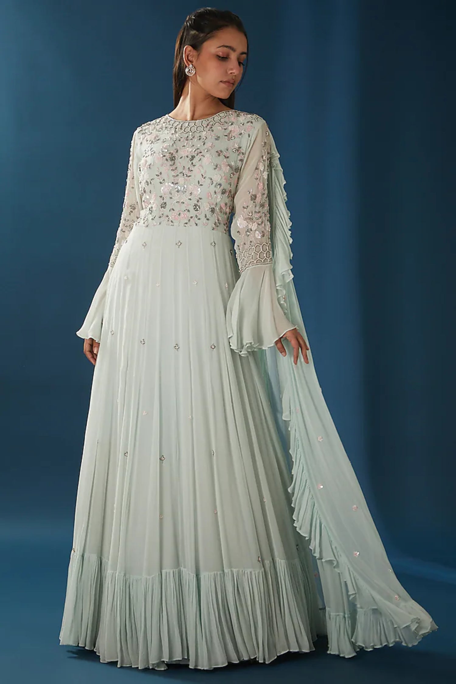 Ice-Blue Tired Gown With Bell Sleeves.
